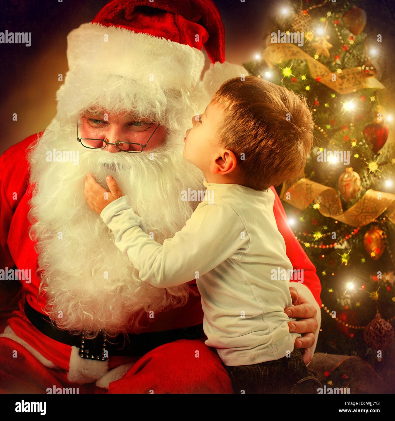 Santa Claus and Little Boy. Christmas Scene Stock Photo - Alamy