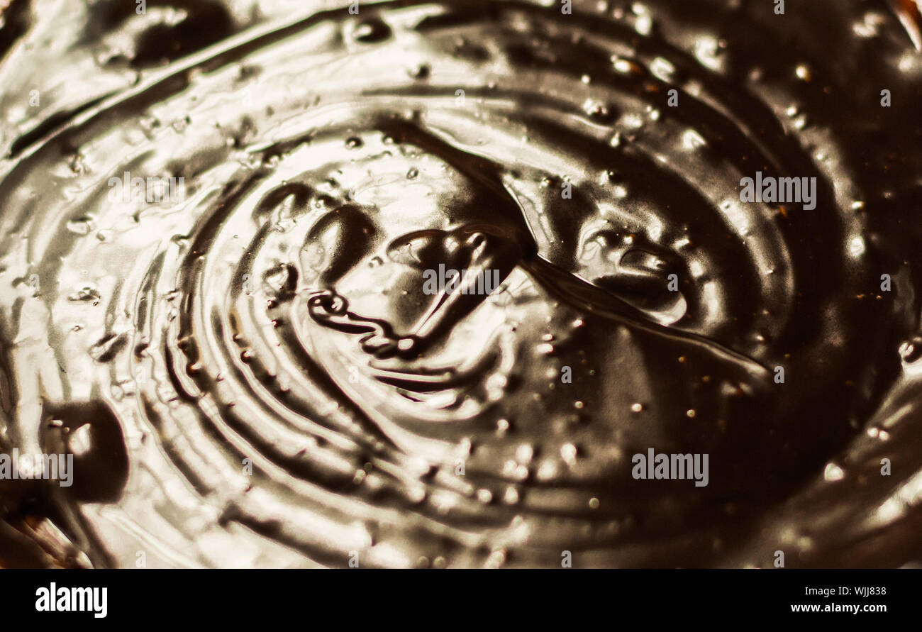 Melted chocolate ganache cream. Food background and pattern texture ...