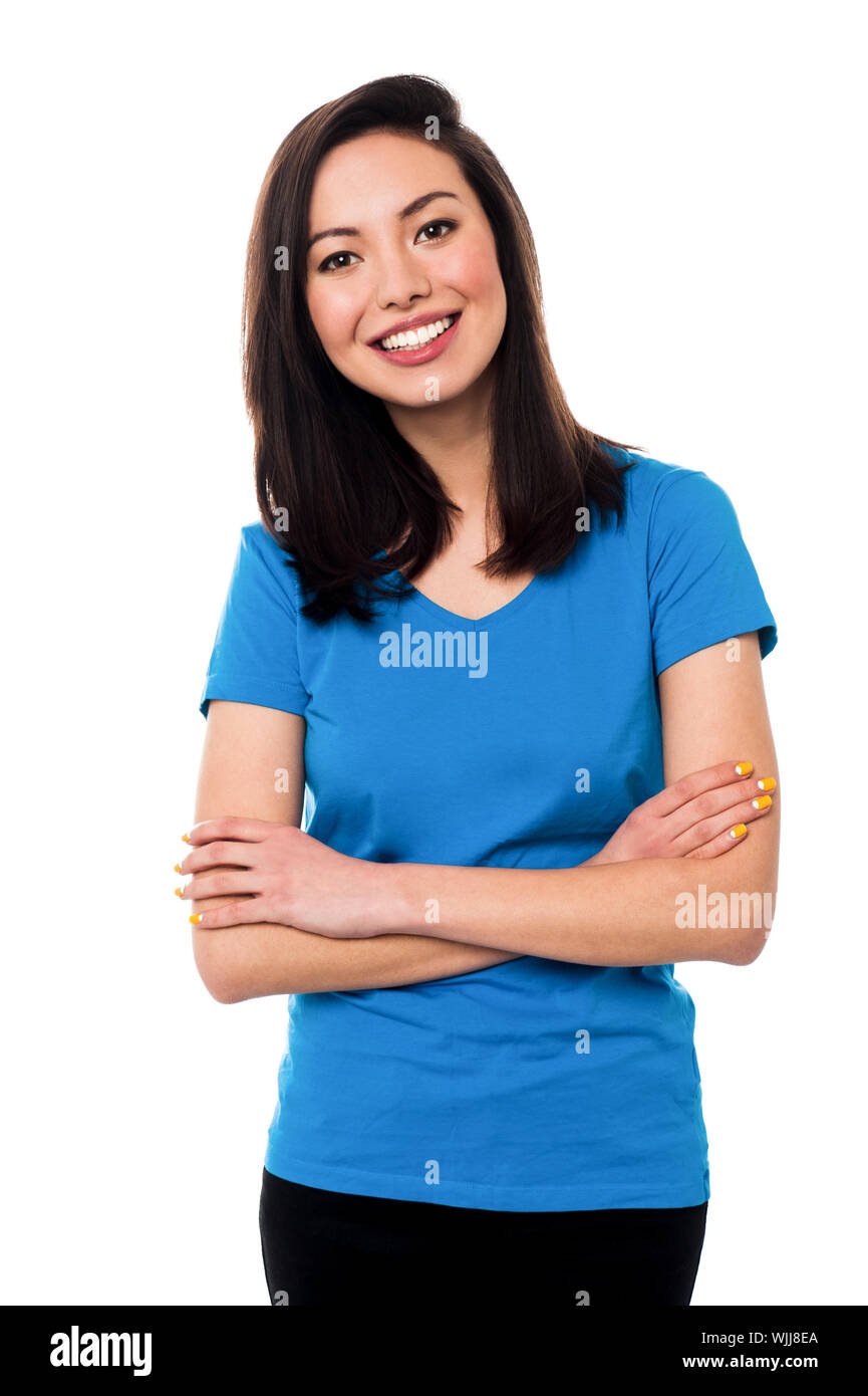 Beautiful young girl posing with crossed arms Stock Photo - Alamy