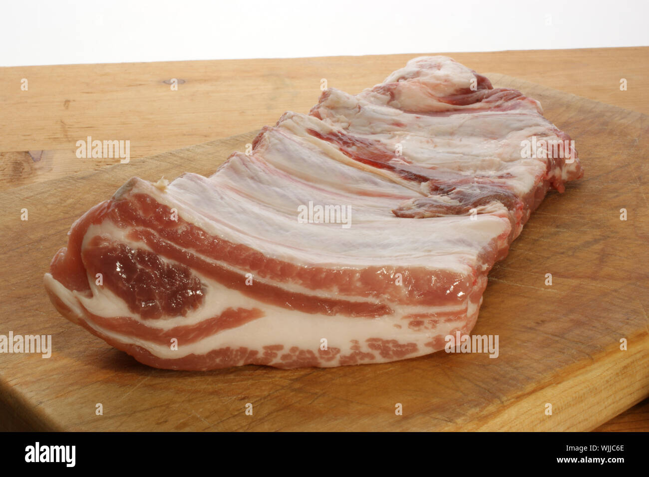 raw pork rips on a timber board Stock Photo - Alamy