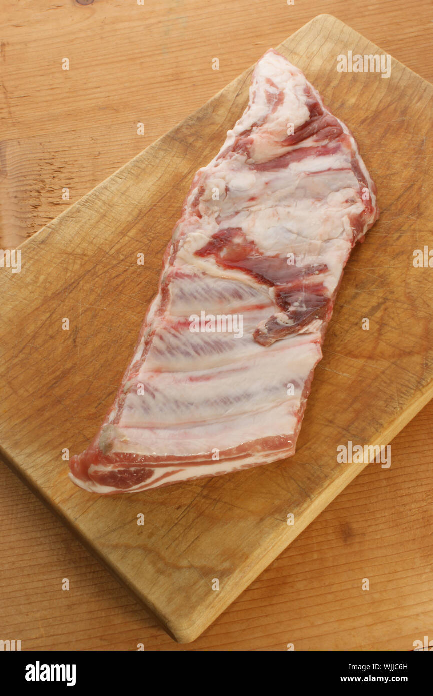 raw pork rips on a timber board Stock Photo - Alamy