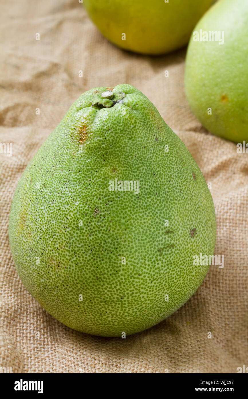 Pompelmous on desk, fresh fruit look like grapefruit Stock Photo - Alamy