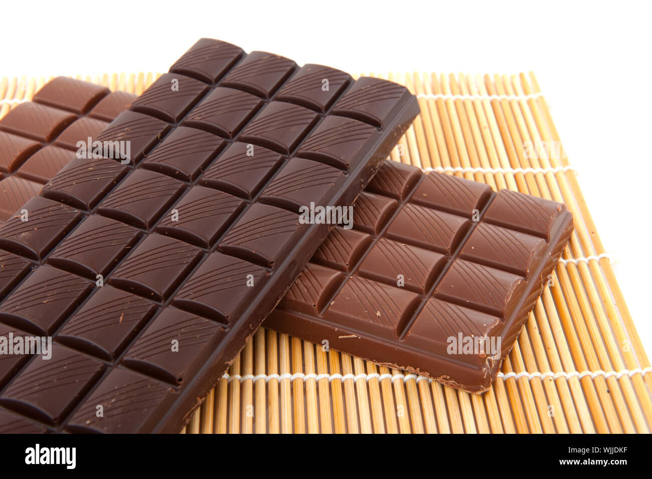 Dark and light chocolate on natural bamboo Stock Photo - Alamy