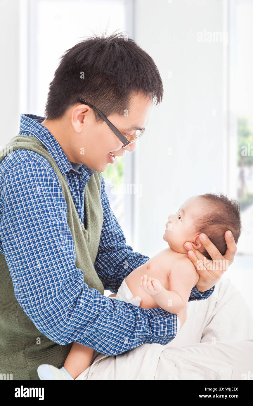 Happy father hug his smiling son at home Stock Photo - Alamy