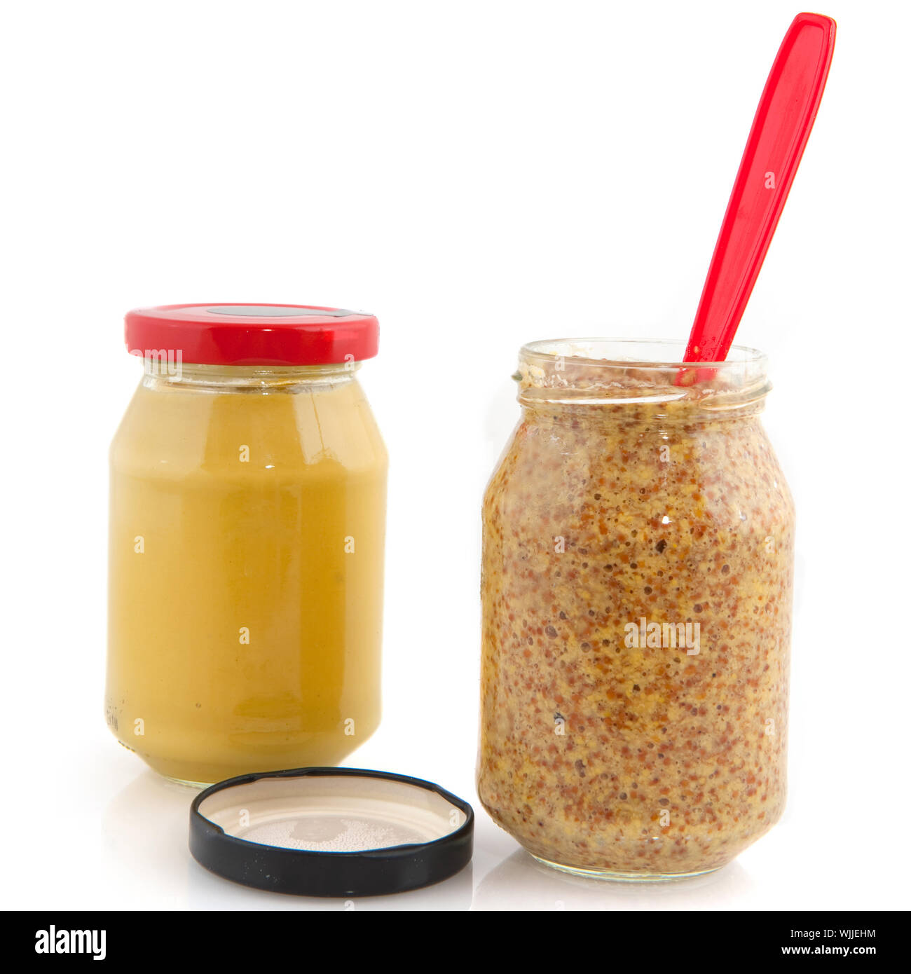 Two different kind of mustards isolated over white Stock Photo - Alamy