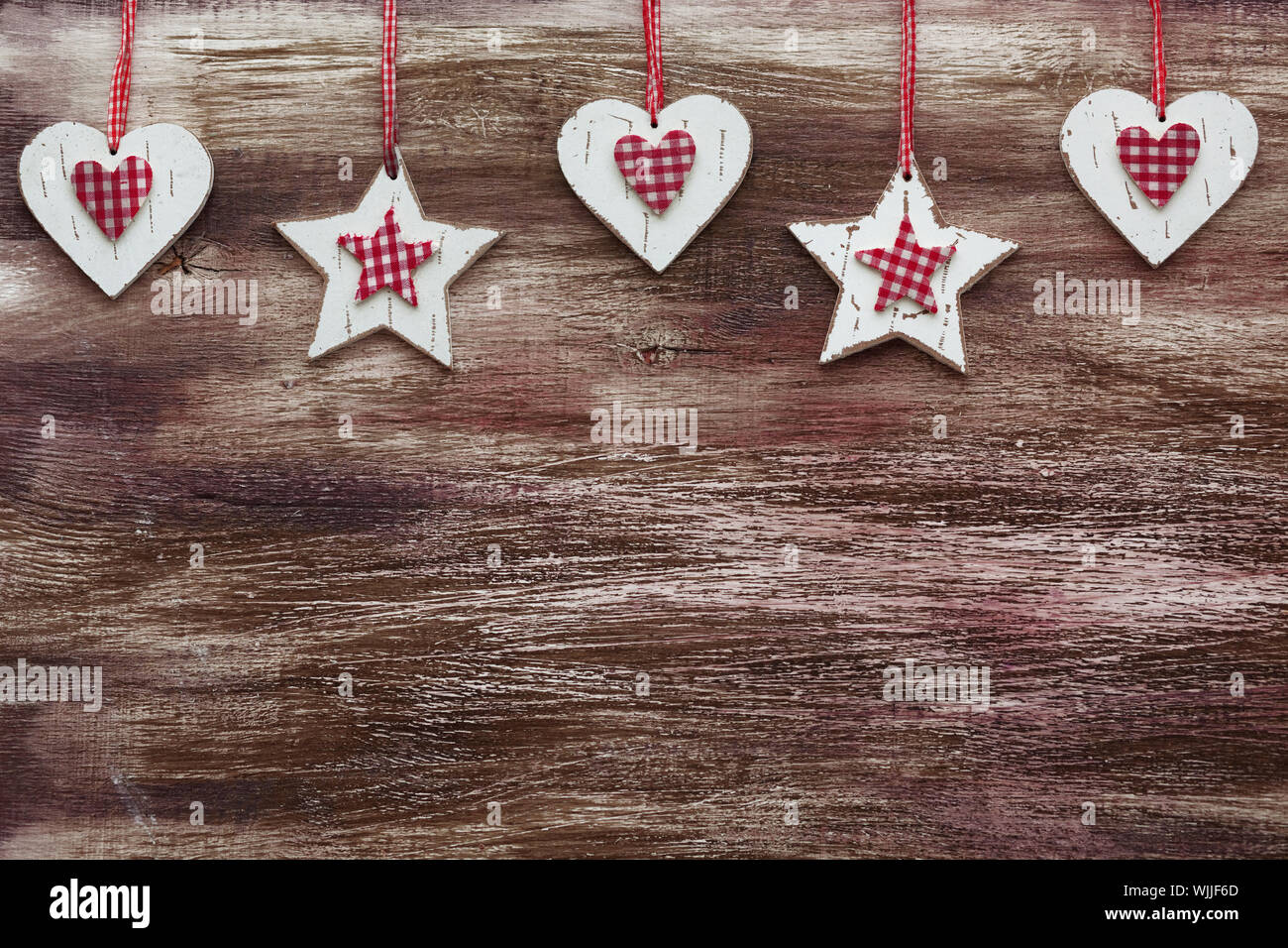 Shabby chic wooden shapes on rustic background Stock Photo - Alamy