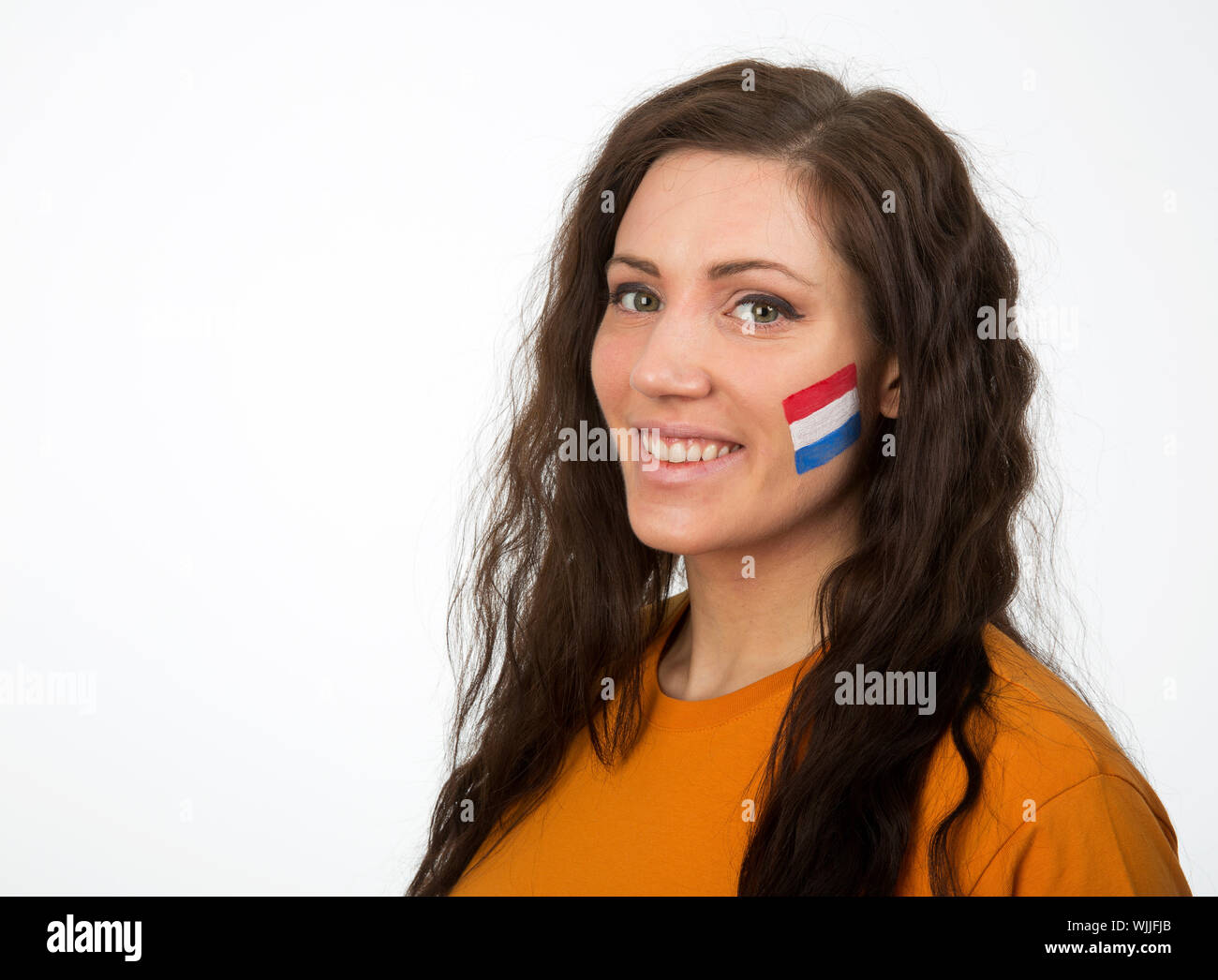Young Girl with the Dutch flag painted in her face Stock Photo - Alamy