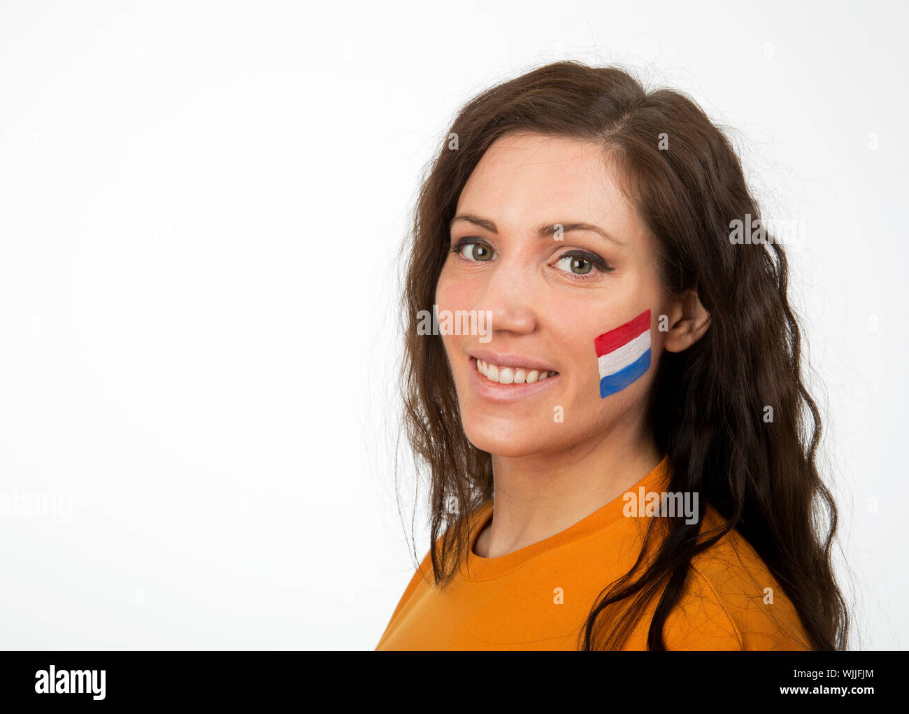 Young Girl with the Dutch flag painted in her face Stock Photo - Alamy