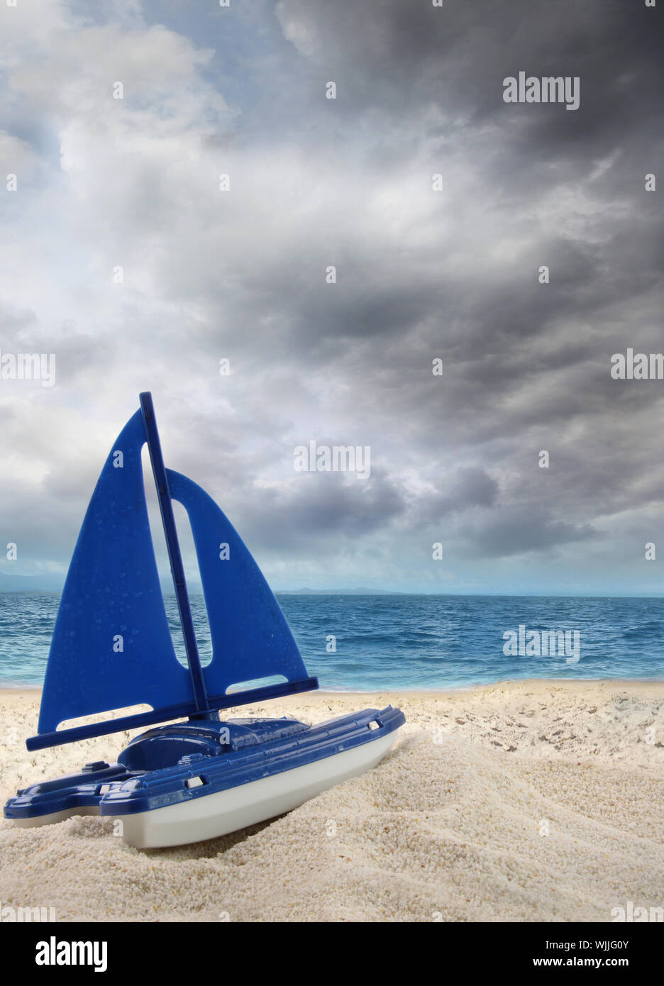 Plastic toy boat in sand hi-res stock photography and images - Alamy