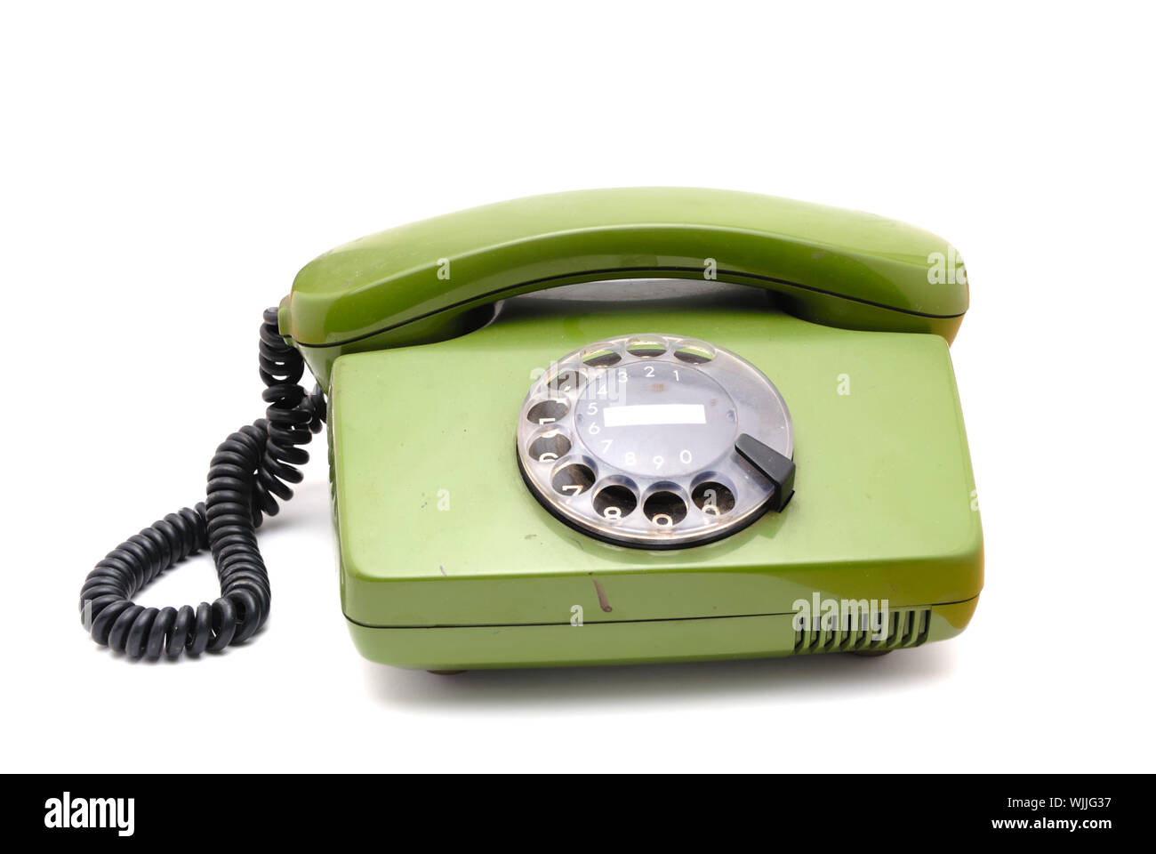 Old analogue disk phone on a white background Stock Photo - Alamy