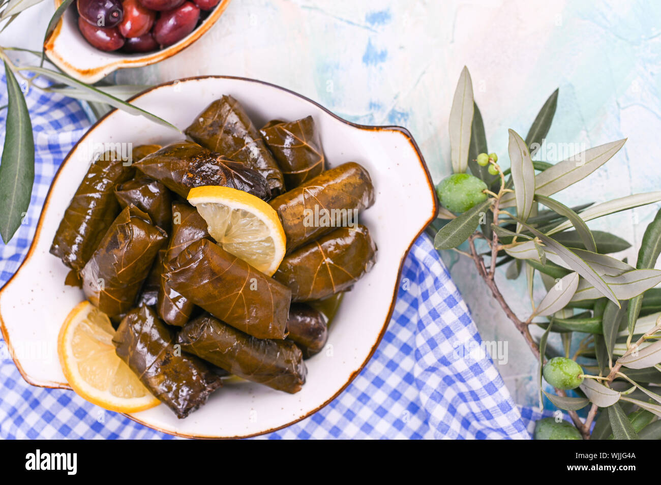Traditional greek cuisine. Wrapped rice in grape leaves. Dolma with ...
