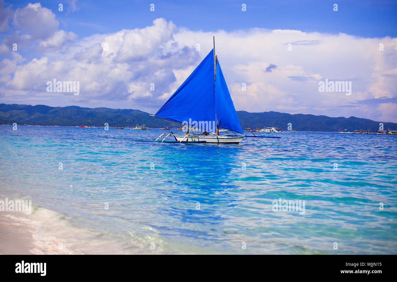 Blue Boats on Boracay island in the sea, Philippines Stock Photo - Alamy
