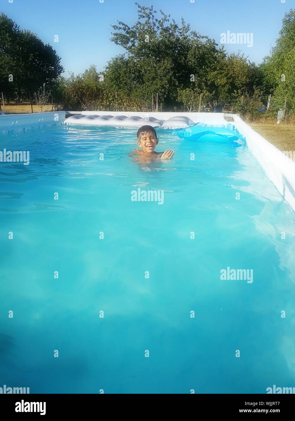 Boy Wading In Water High Resolution Stock Photography and Images - Alamy