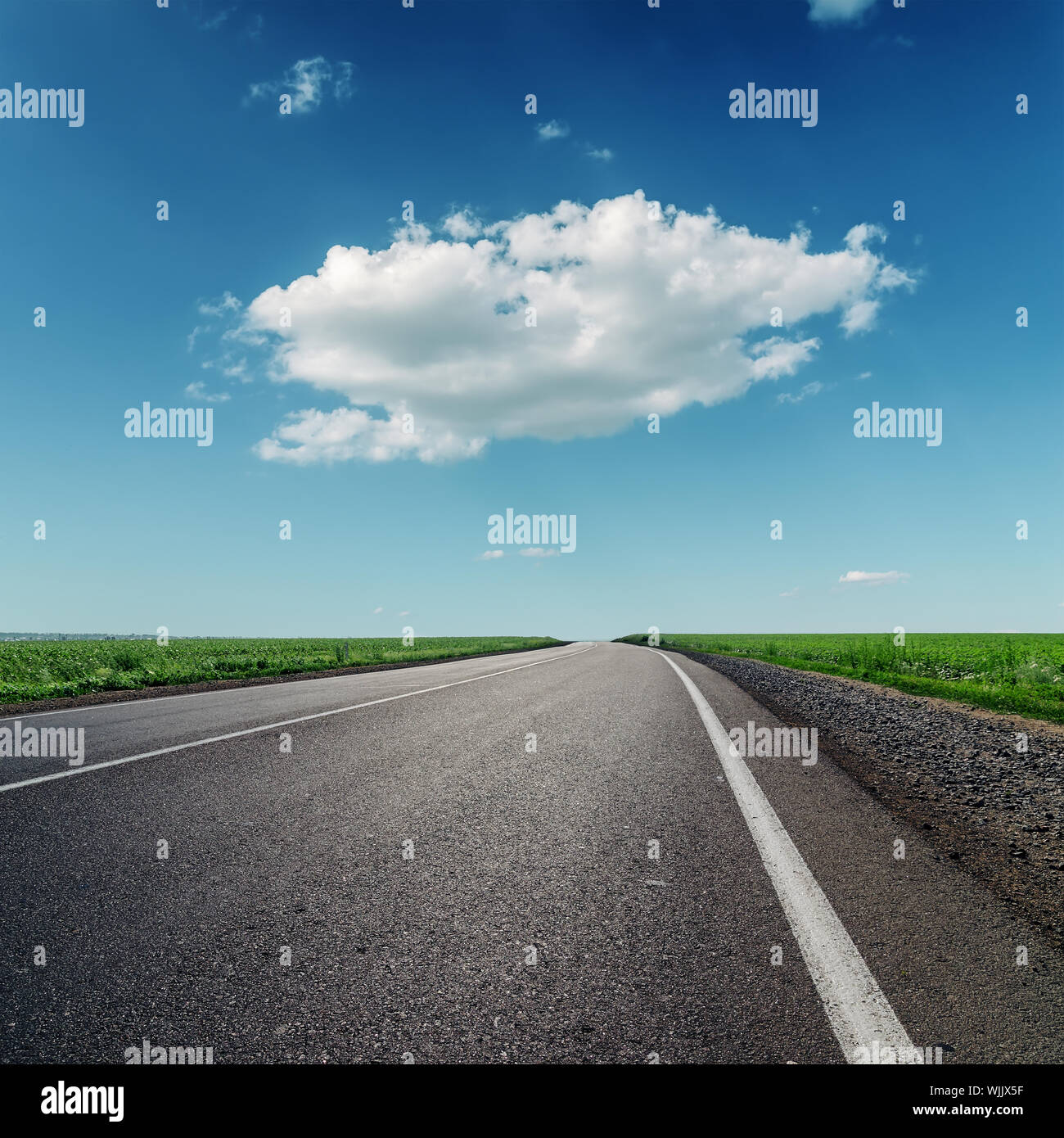 one big cloud and asphalt road Stock Photo - Alamy