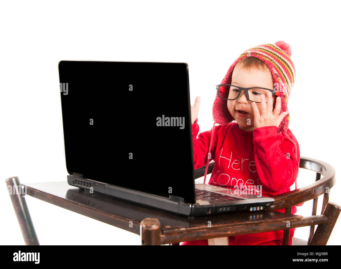 Little child having problems with laptop computer,isolated on white ...