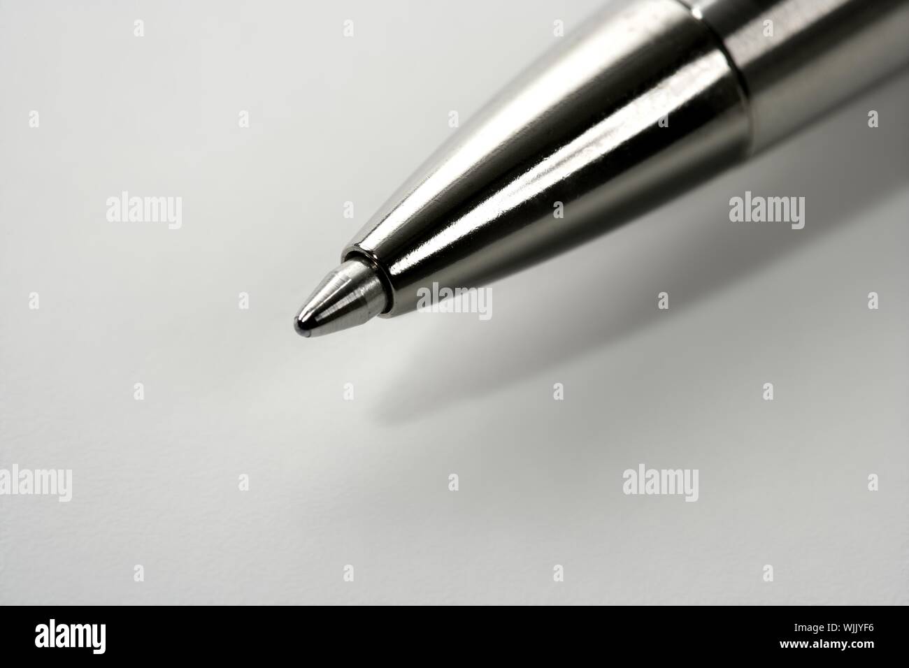 Macro roller silver gray pen point over white background Stock Photo ...