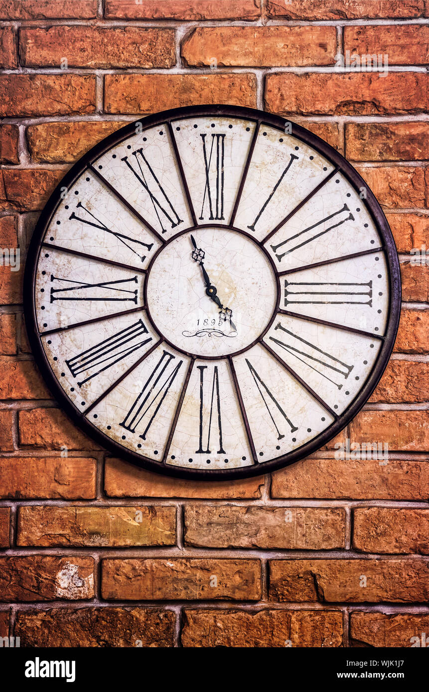 Detail of old vintage clock on textured brick wall Stock Photo - Alamy