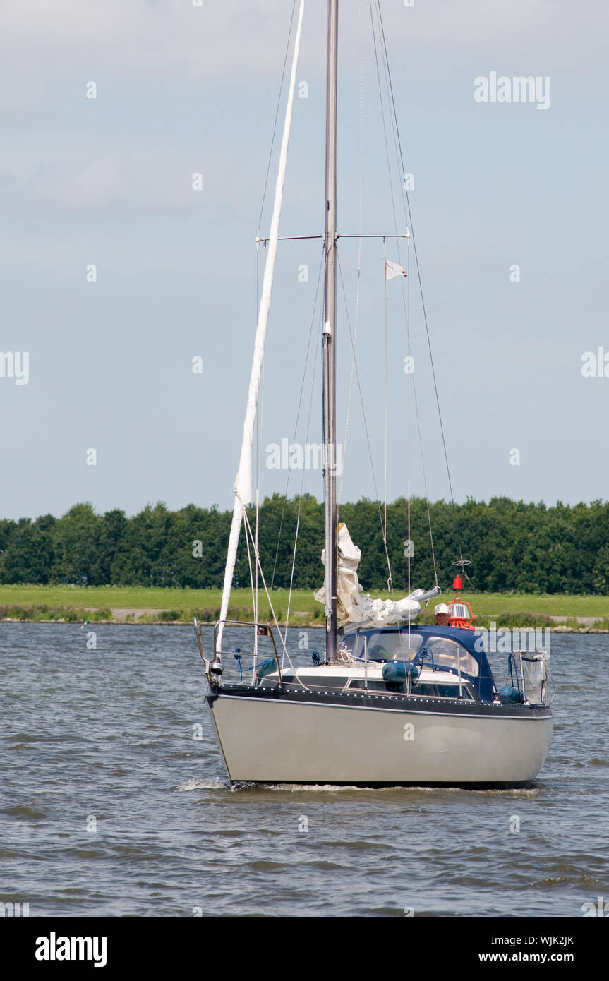 sail boat in landscape at the river Stock Photo - Alamy
