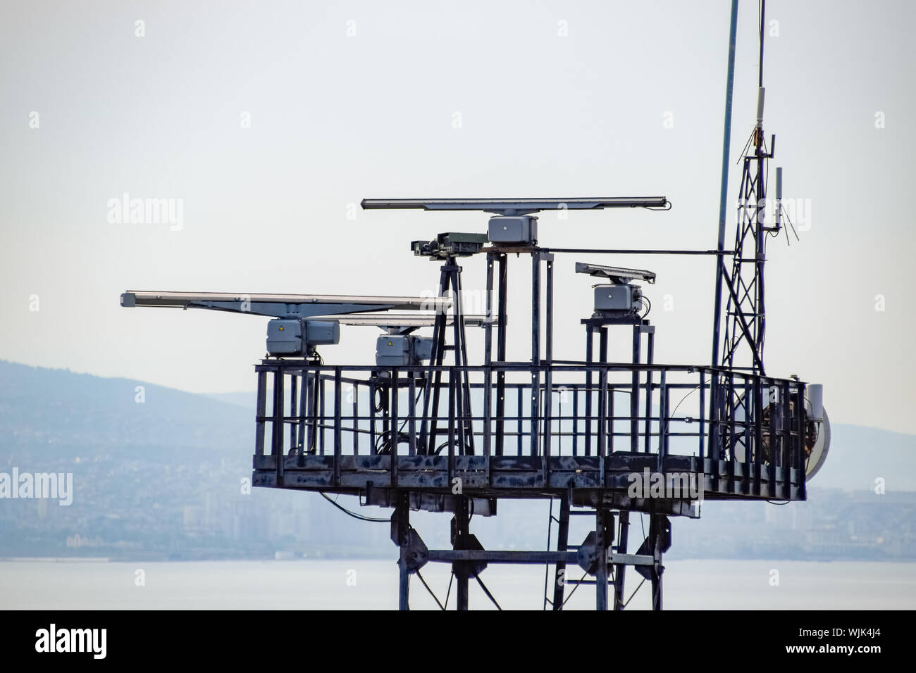 Rotating antennas of a military radio station on a tower Stock Photo ...