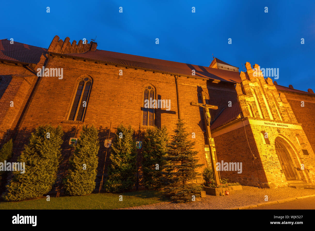 Collegiate Basilica of St. George in Ketrzyn at night. Ketrzyn, Warmian ...