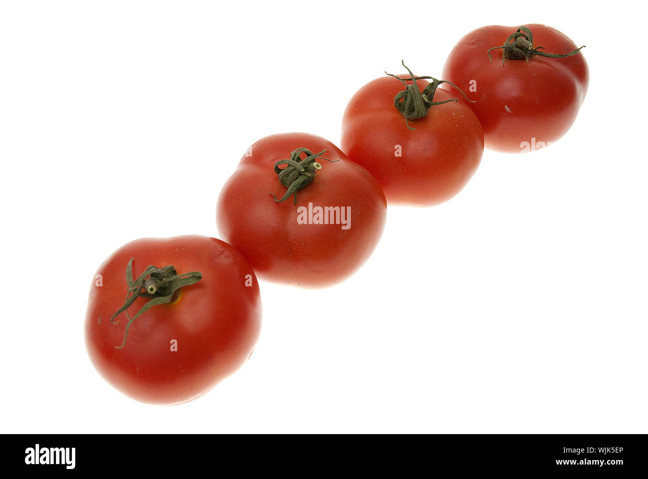 Four tomatoes on plant Cut Out Stock Images & Pictures - Alamy