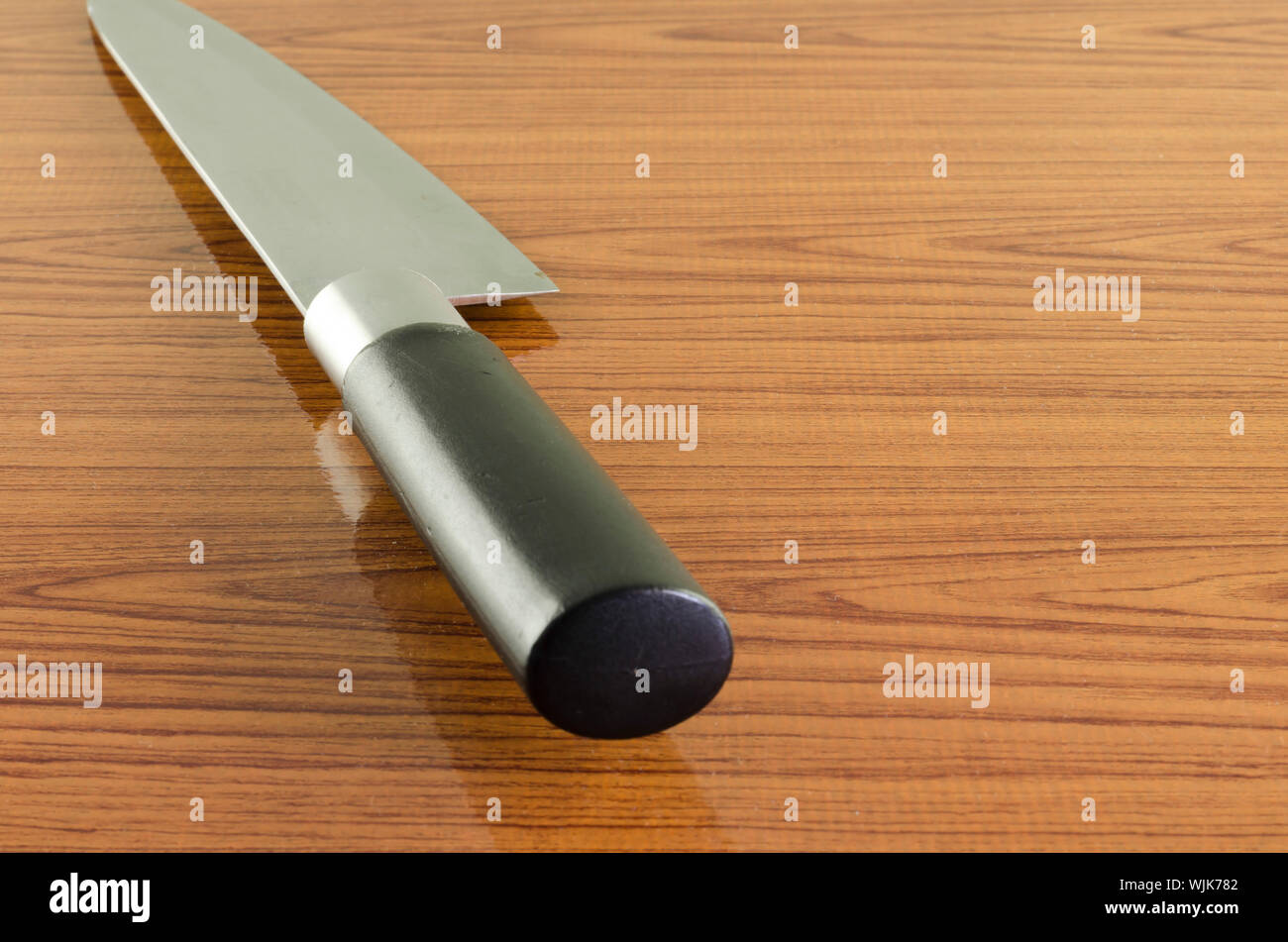 kitchen knife on wood table background Stock Photo - Alamy