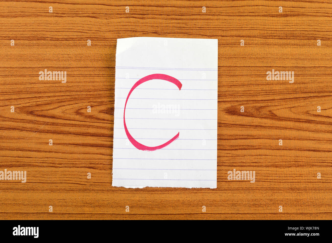 grade c on wood wall background Stock Photo - Alamy