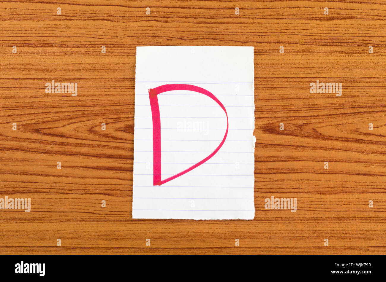 grade d on wood wall background Stock Photo - Alamy