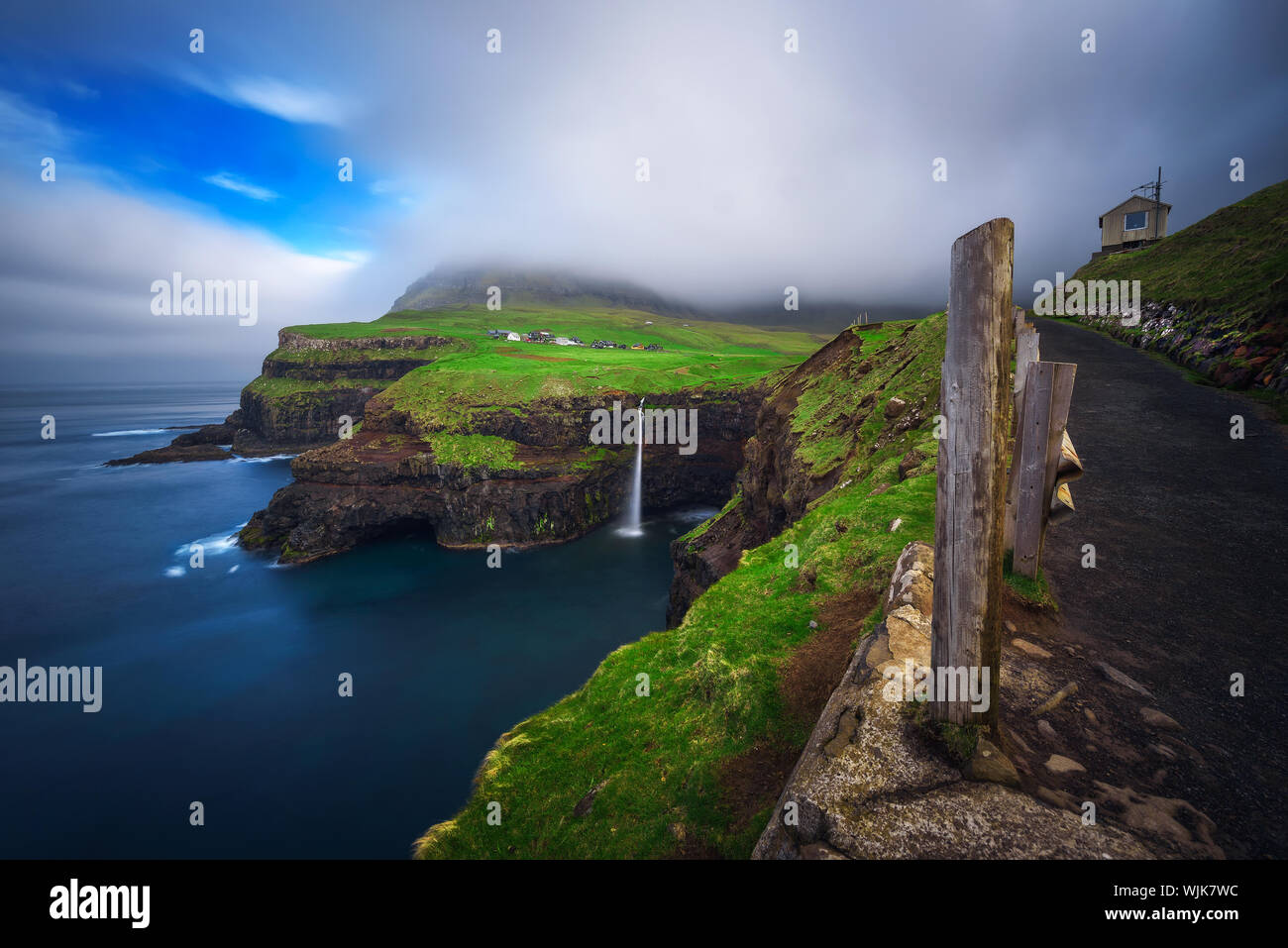 Gasadalur village and Mulafossur waterfall on Faroe Islands, Denmark ...