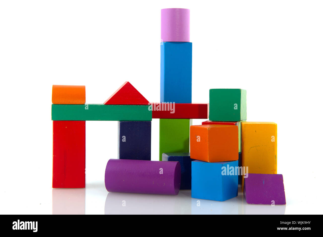 Colorful wooden toy blocks isolated over white Stock Photo - Alamy