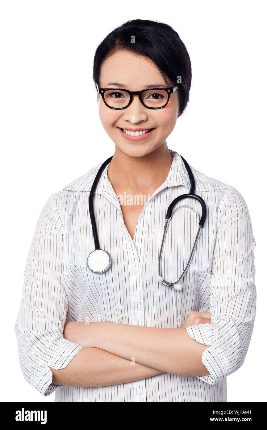 Young pretty female doctor with arms folded Stock Photo - Alamy