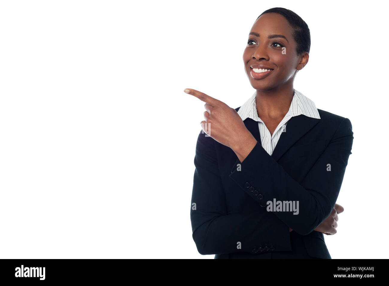 Smiling corporate lady pointing hi-res stock photography and images - Alamy