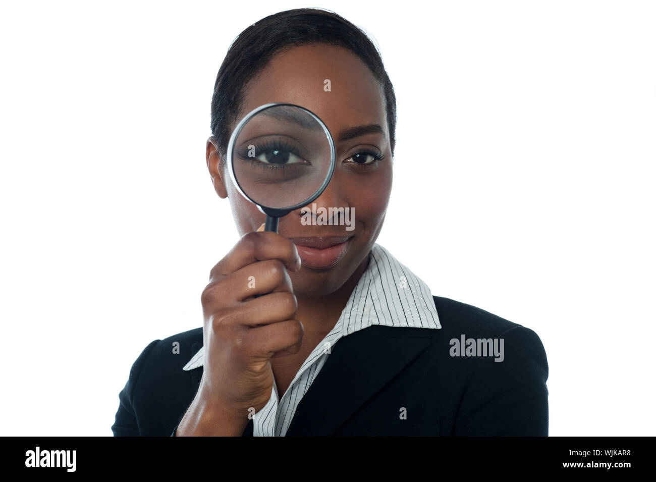 Female executive looking through lens Stock Photo - Alamy