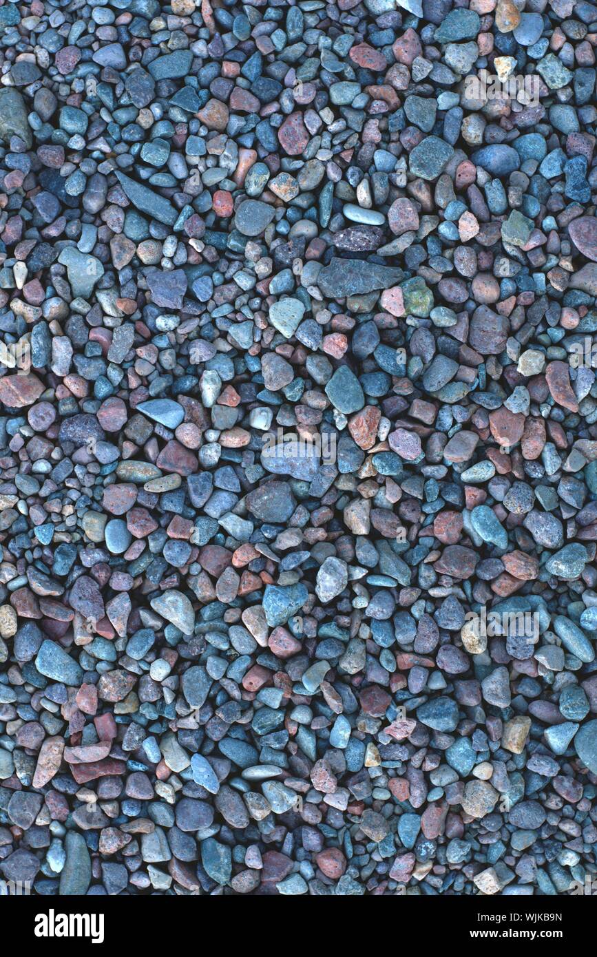 Small river pebbles on a gravel path. Texture detail Stock Photo - Alamy