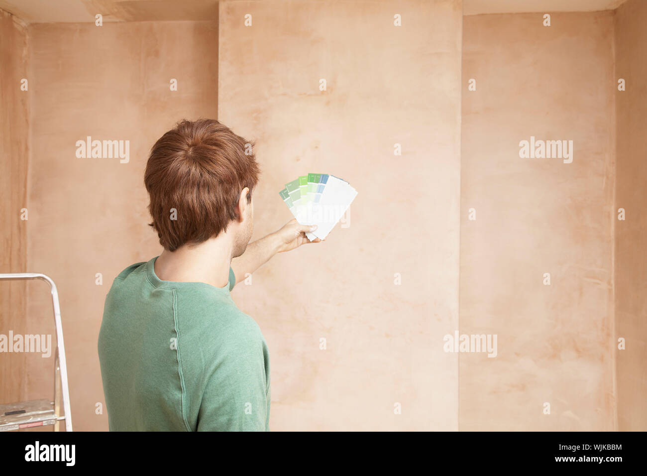 Man Looking at Paint Color Swatches Stock Photo - Alamy