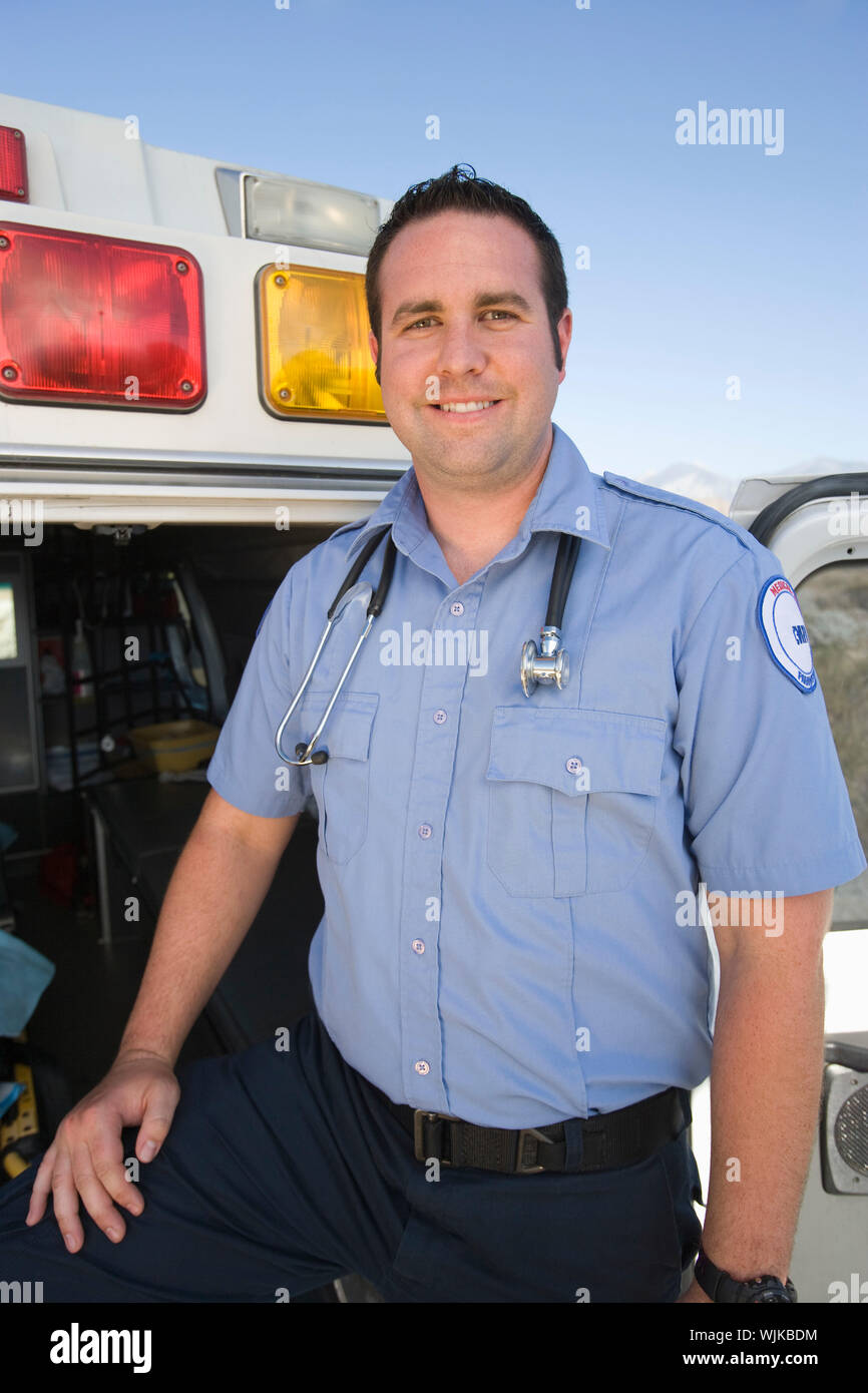 Portrait of paramedic by ambulance Stock Photo - Alamy
