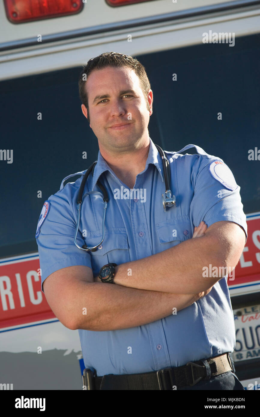 Portrait of paramedic by ambulance Stock Photo - Alamy