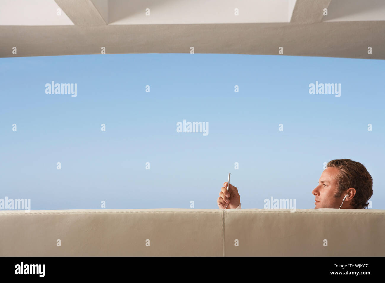 Man Using MP3 Player Stock Photo - Alamy