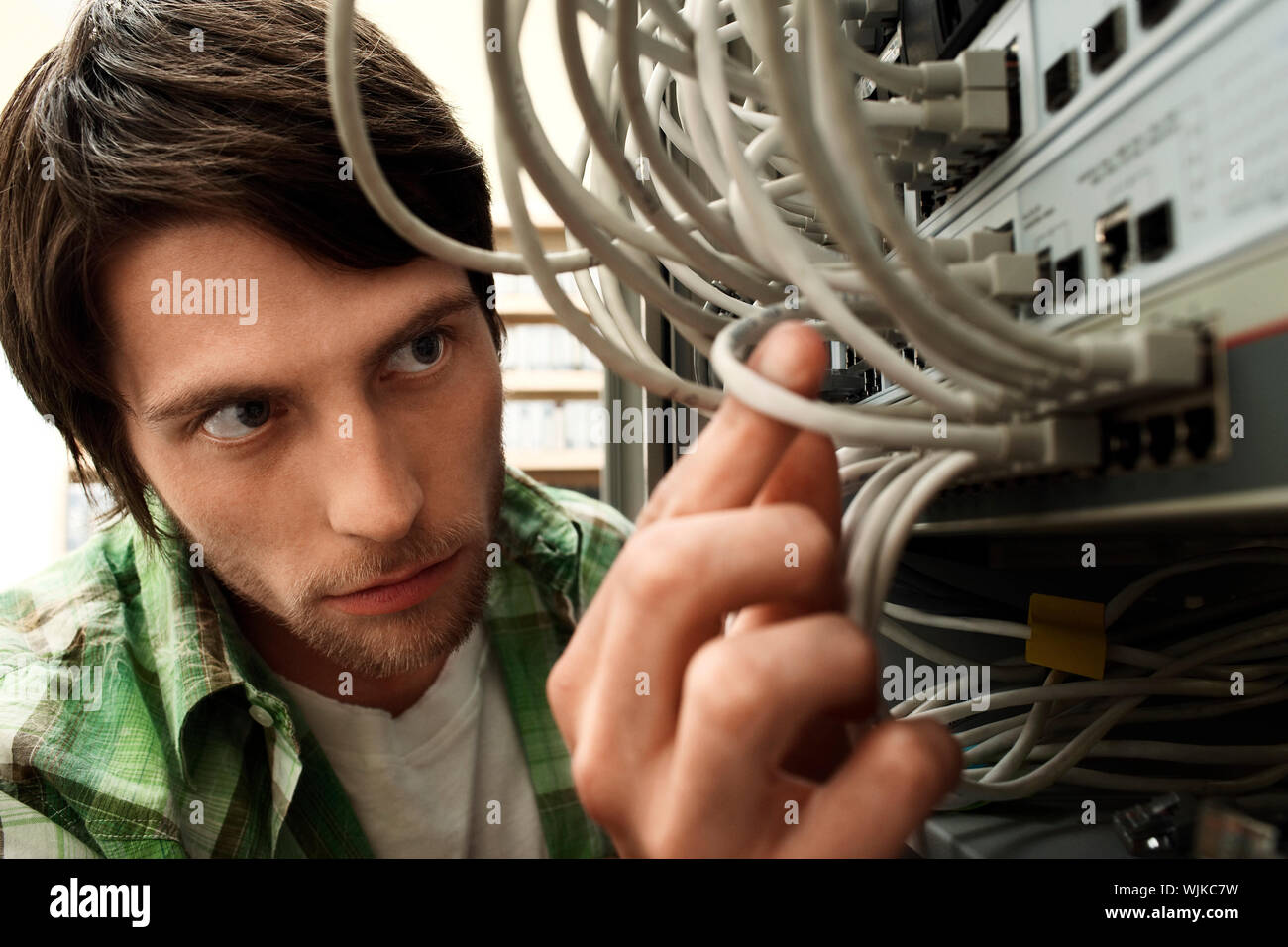 Engineer connecting network cable switch hi-res stock photography and ...
