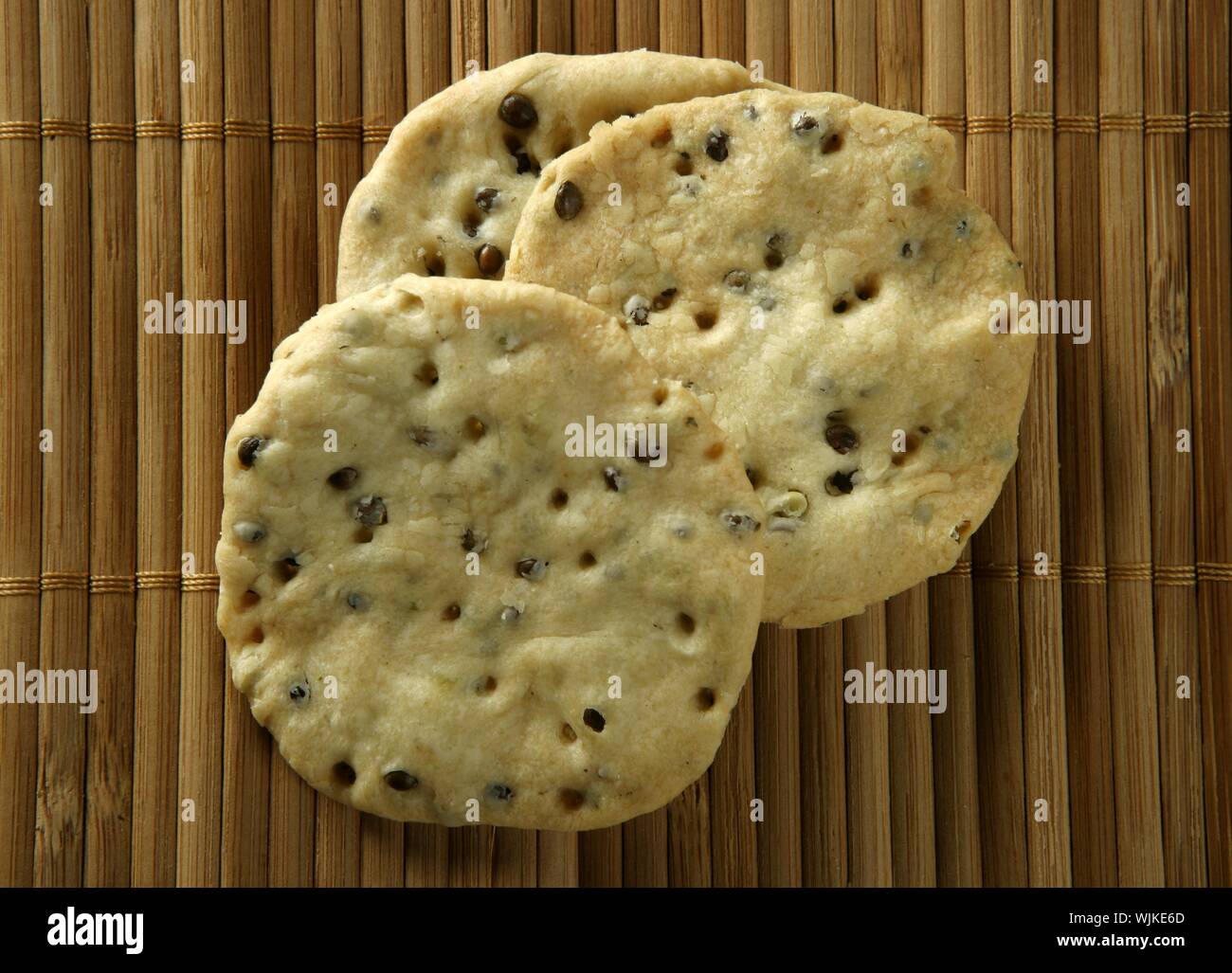 Sesame seeds biscuits over bamboo stripes Stock Photo - Alamy