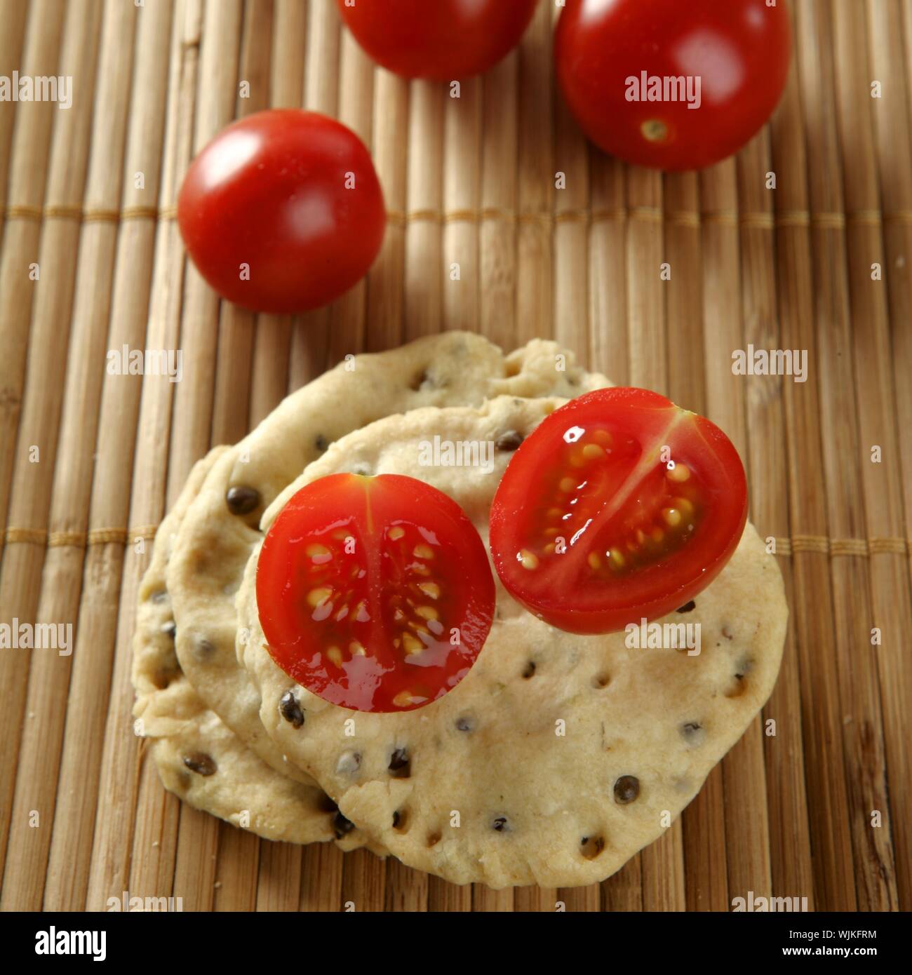 Sesame seeds biscuits over bamboo stripes Stock Photo - Alamy
