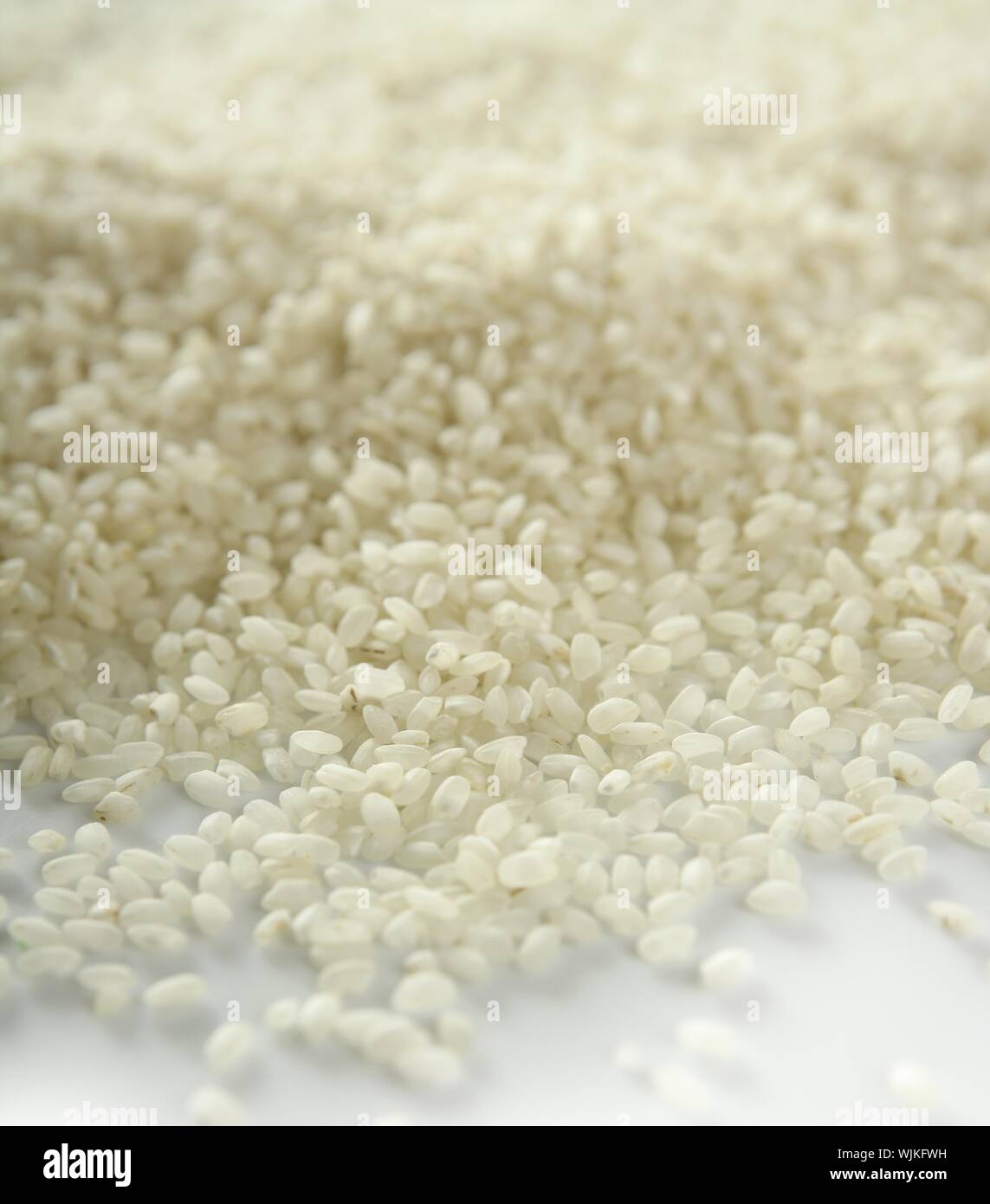 White rice close up texture. Background pattern of rice seeds from ...
