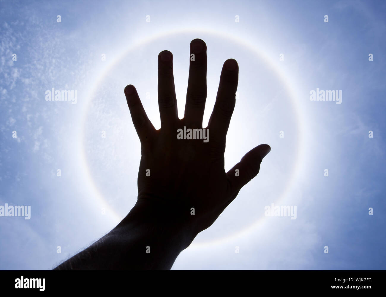 hand that shadow from Halo - sunlight phenomenon Stock Photo - Alamy