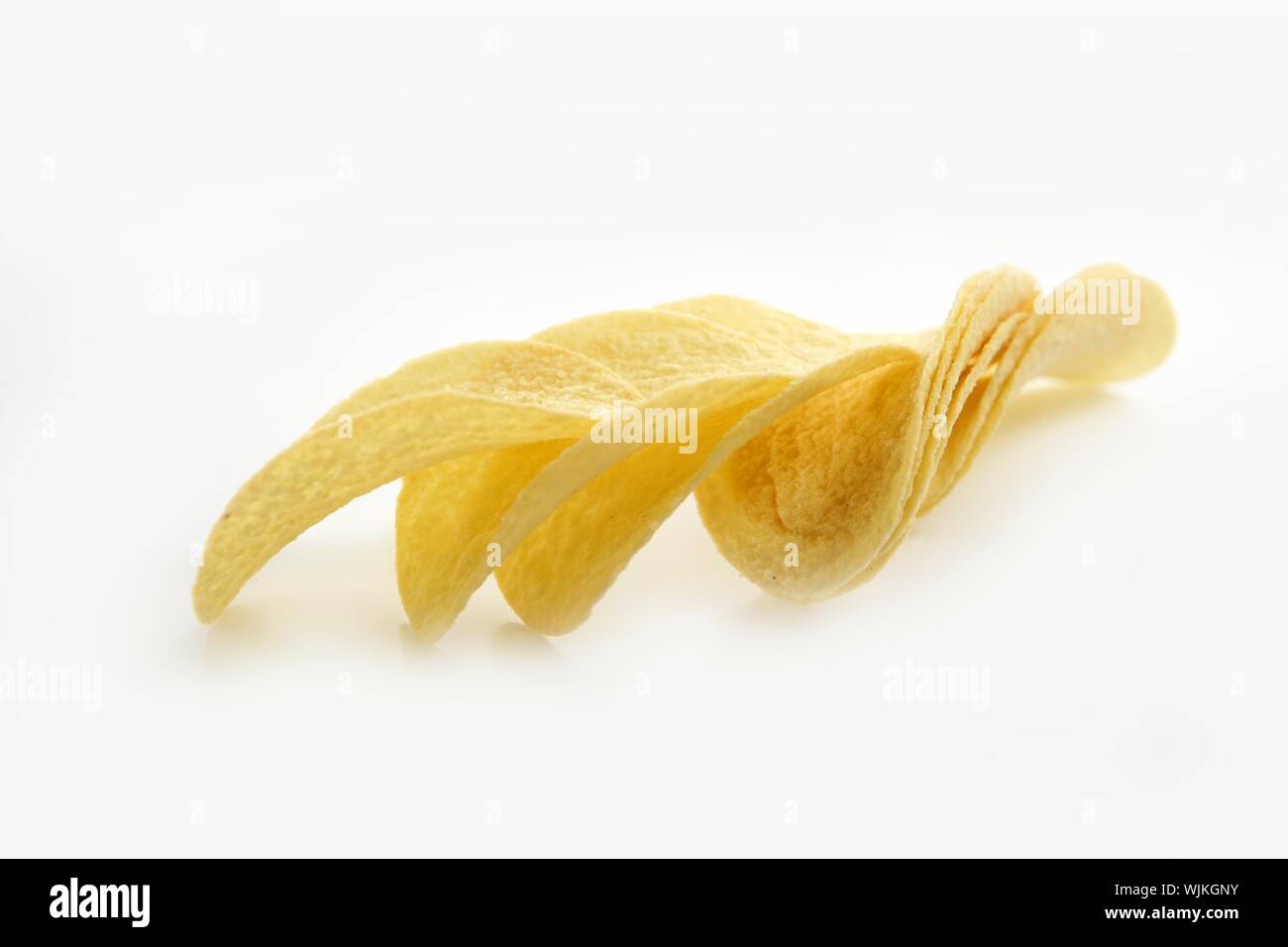 Potato salted chips slices over white background Stock Photo - Alamy