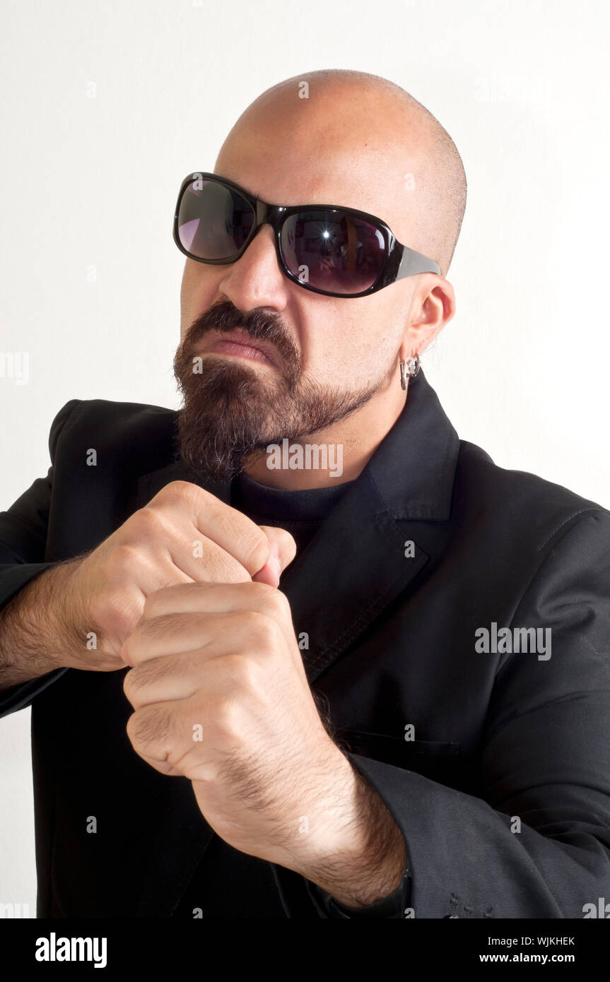 blacks man with glasses, beard and black jacket, bouncer bodyguard ...