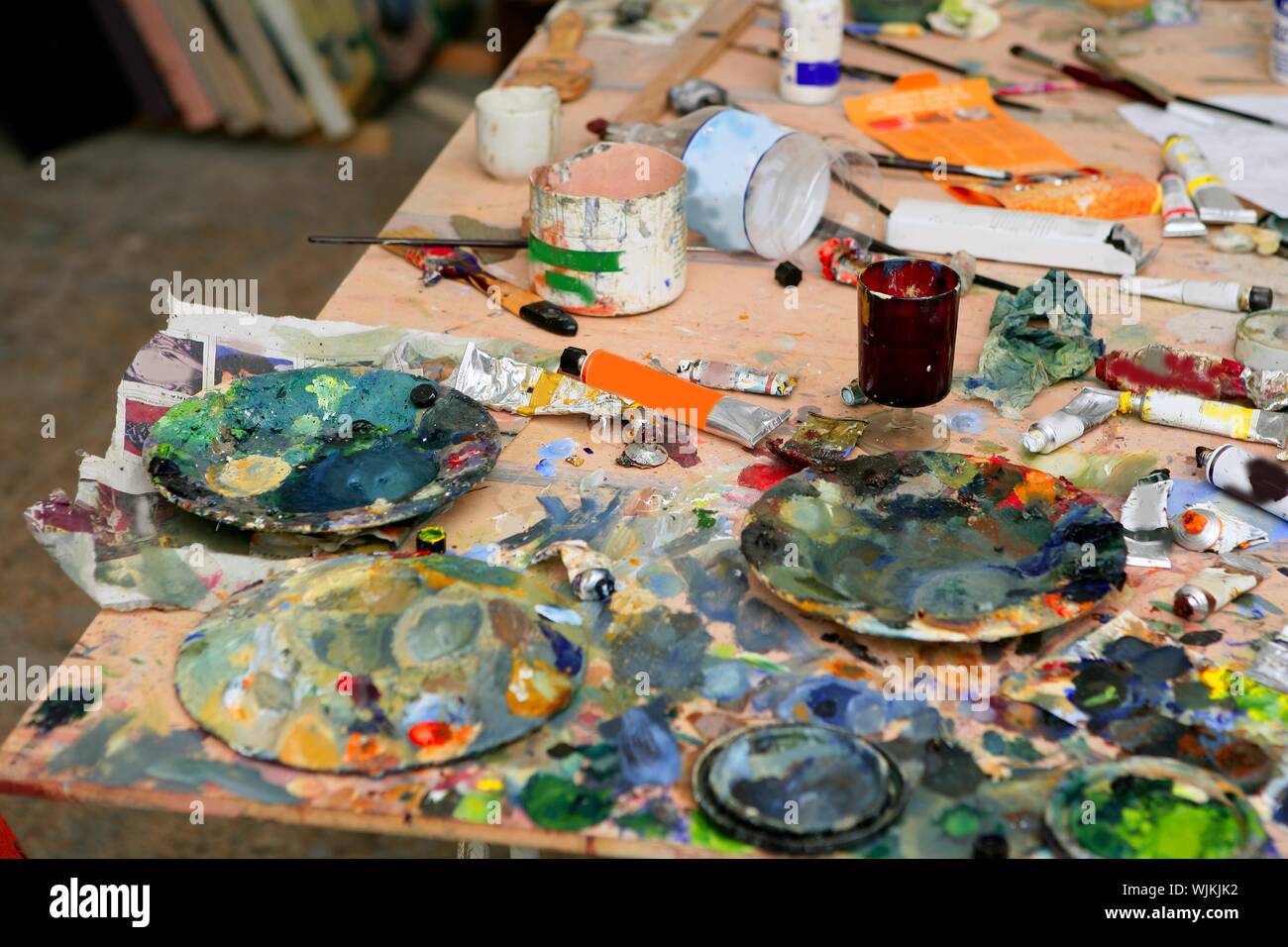 Artist studio painted dirty table, colored in many colors Stock Photo ...