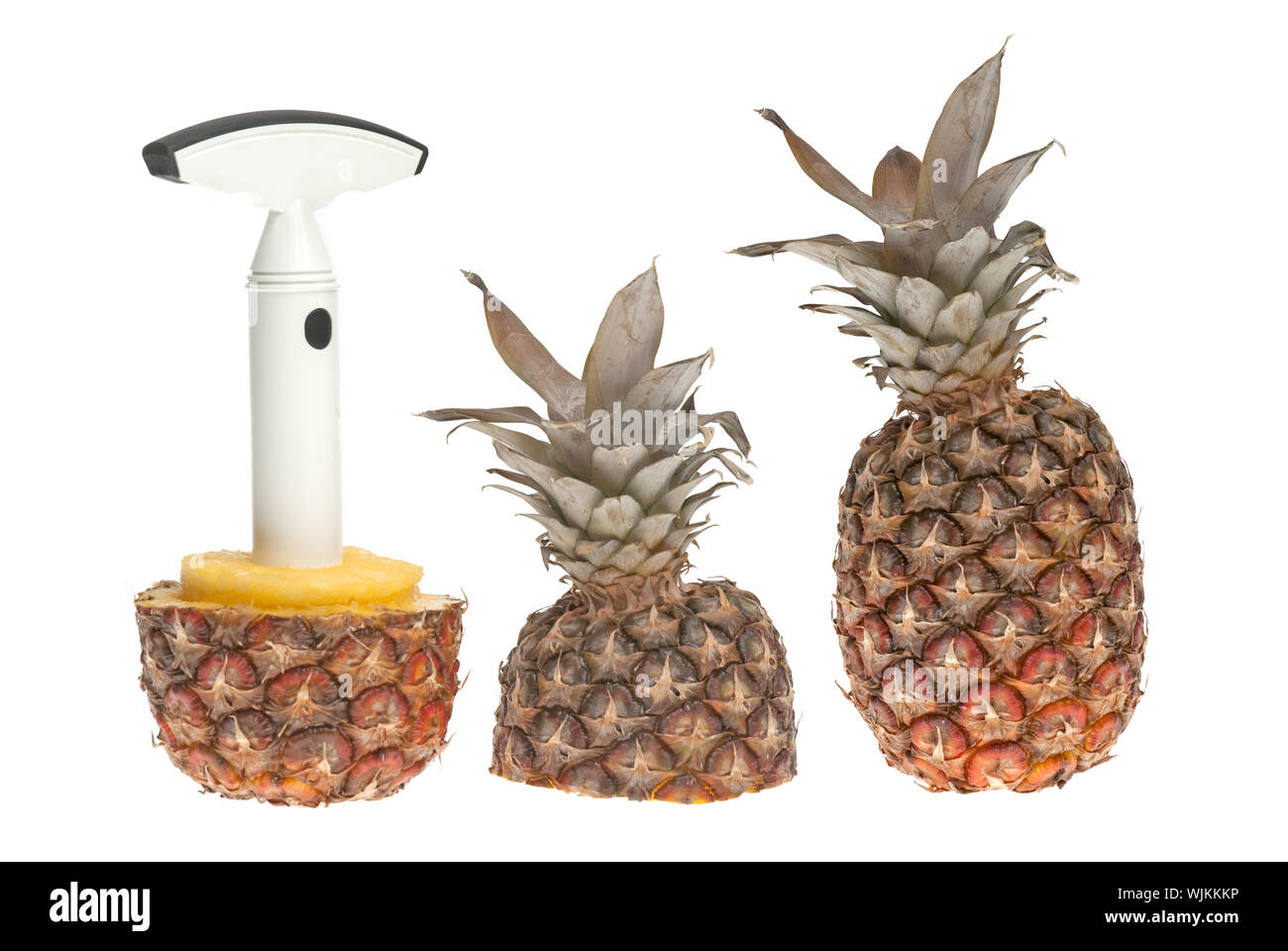 Whole and split pineapple with cutter isolated on white background ...