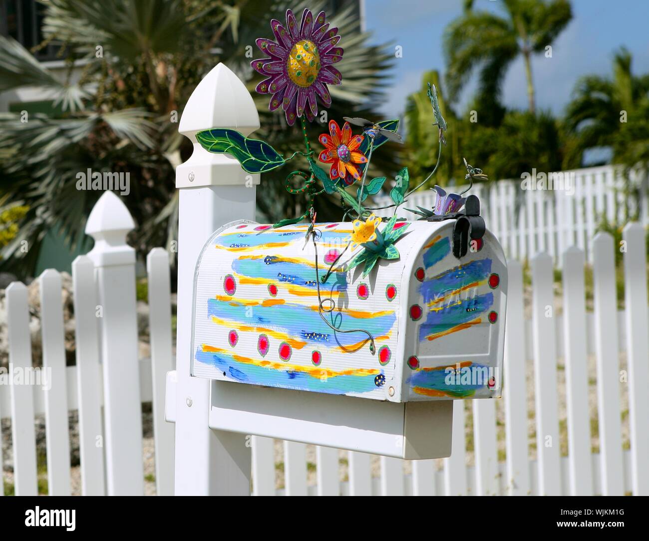 Fun artistic mail box with spring flowers decoration Stock Photo - Alamy