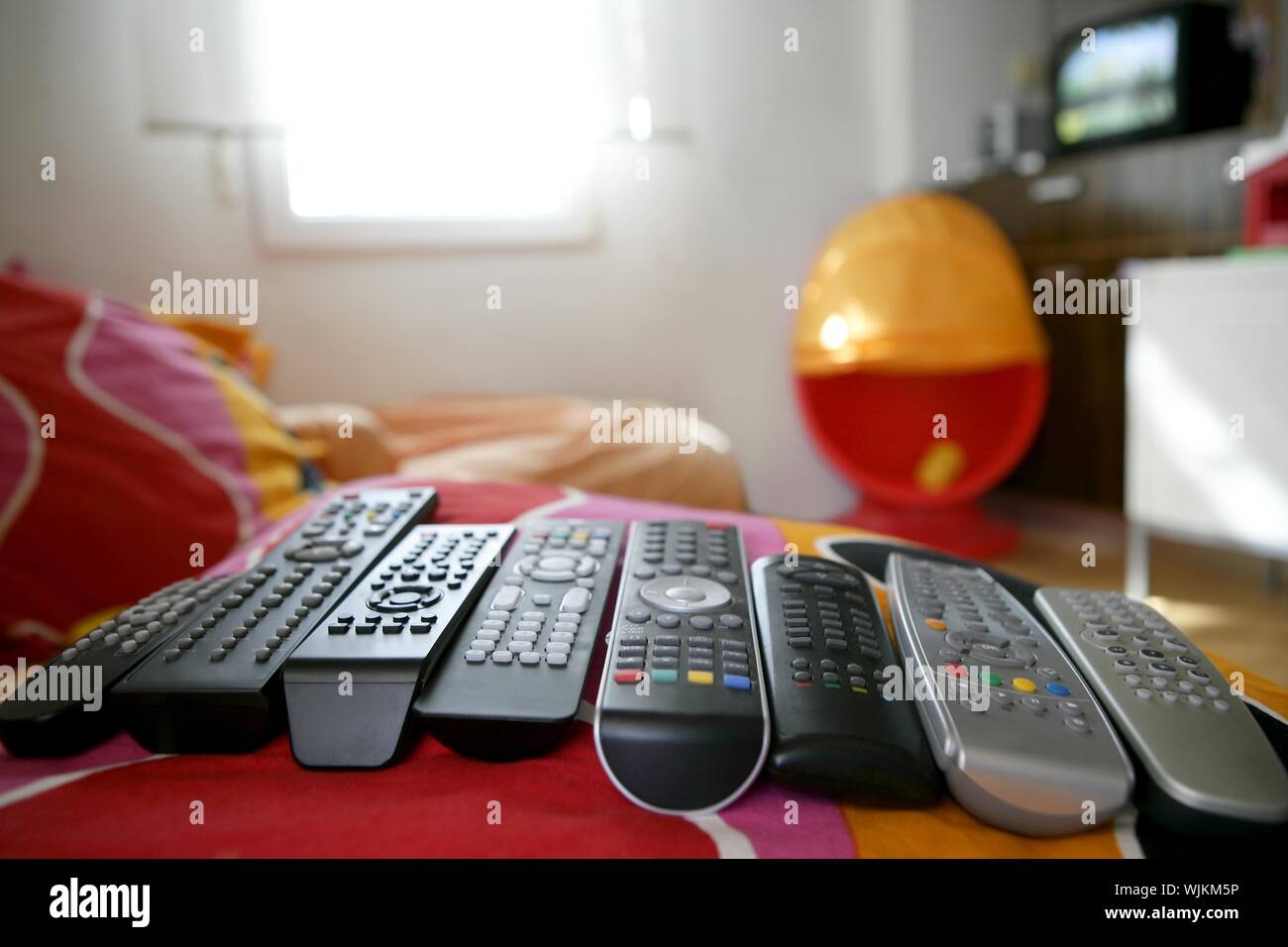 many remote control for only one house, excess technology metaphor ...