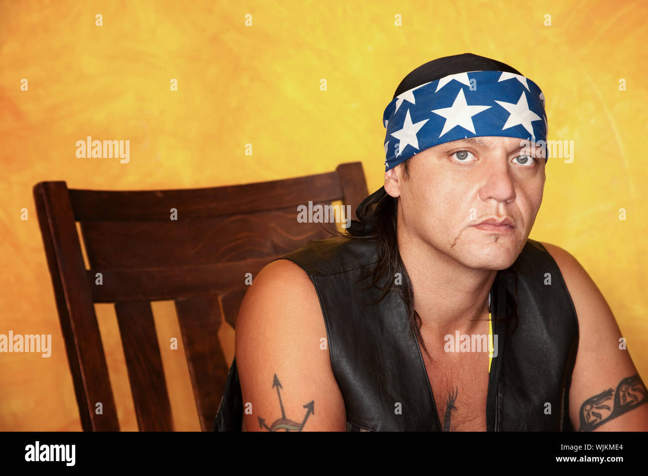 Kneeling Native American man in rocking chair Stock Photo - Alamy